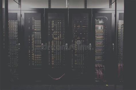 A Lone Dimly Lit Server In A Dark Room Illustrating The Isolation Of Data In The Digital Age