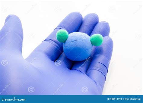 scientist researcher or teacher holding model of chemical formula of