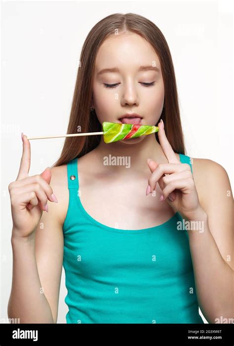 Teenager Girl Licking The Lollipop Sweet Tooth Concept Stock Photo Alamy