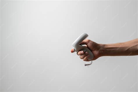 Premium Photo A Gamer Holding A Wireless Joystick Controller Pushing