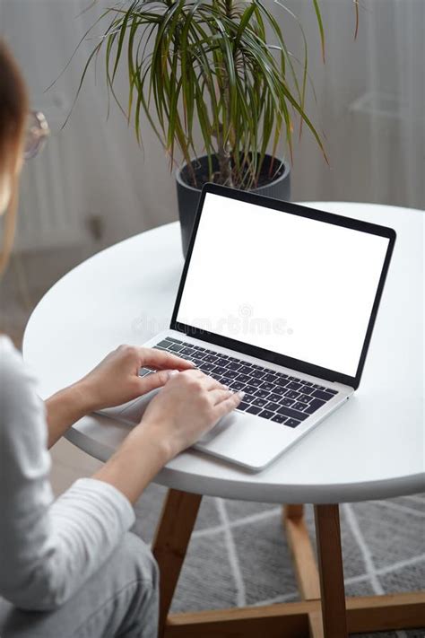 Mockup White Screen Laptop Woman Using Computer While Sitting At Table At Home Back View Stock