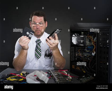 Man With Computer And Various Hardware Components Stock Photo Alamy