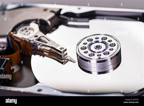 Detail Of A Opened Hard Disk With Write And Read Head And Disk Stock