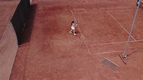 Capturing Video With Drone Birds Eye View At The Tennis Court Outside
