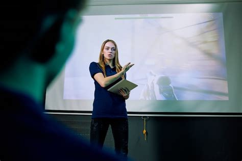 Premium Photo Confident Female Game Developer Using Tablet While