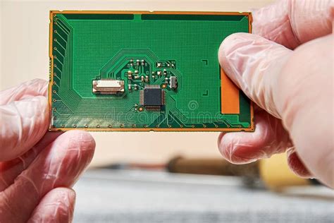 An Engineer Keeps And Examines The PCB With A Microchip In Tech Laboratory Stock Photo Image