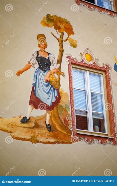 Drawing Of A Woman On A Building Near The Window A Woman Holding A Basket In Her Hands From