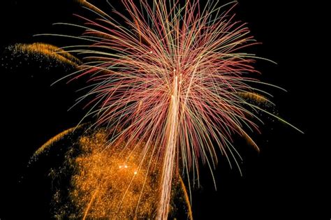 Premium Photo Fireworks Light Up The Sky In A Dazzling Display