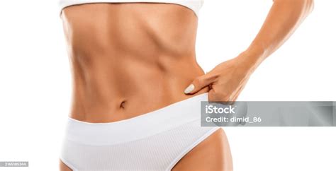 Girl Pulls The Skin On The Abdomen Showing The Body Fat Treatment And