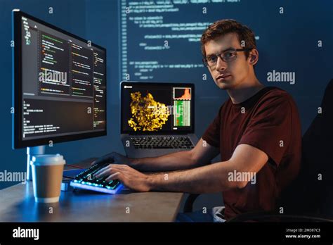 Portrait Of Intelligent Male Programmer Working On Pc Writing Brand New Code At His Home Office