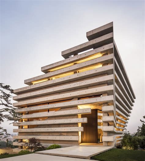 Contaminar Stacks Concrete Layers To Enclose Twisting Portuguese Home