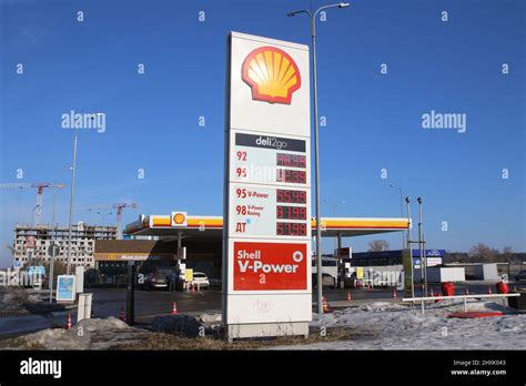 Gasoline Prices Displayed Under A Shell Logo At One Of Their Petrol