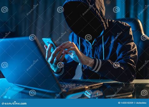 Anonymous Hacker Programmer Uses A Laptop To Hack The System In The