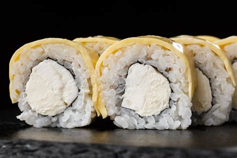 Sushi Rolls With Processed Cheese Cheddar American Cheese And Cream Cheese Inside On Black