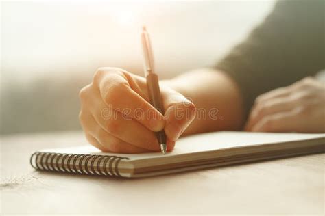 Female Hands Taking Notes Writing With Pen On Notebook Stock Photo