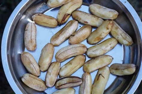 The Process Of Making Dried Bananas Involves Peeling The Bananas
