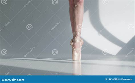 Ballerina Dancing Ballet Feet In Pointe Tied With Ribbons Closeup On