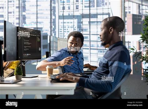 Manager In Wheelchair Checks On Employee Testing Machine Learning