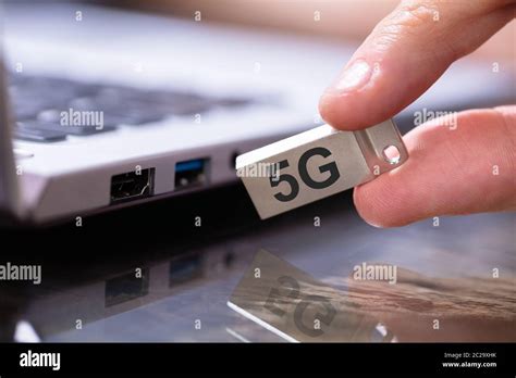Man Connecting G Modem To Laptop Computer Stock Photo Alamy