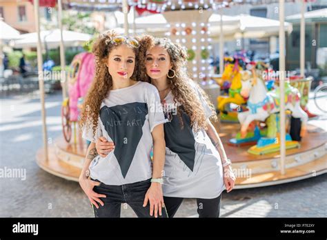 Fashion Blogger Twins In Front Of Carousel Mantova Lombardia Italy
