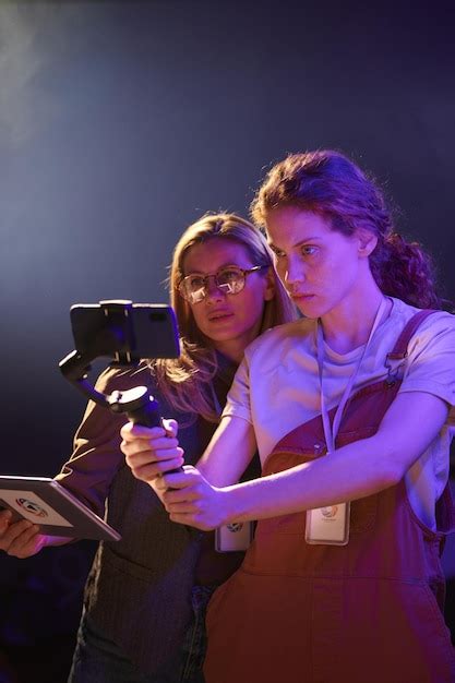Premium Photo Two Women Filming Videos Via Smartphone Backstage