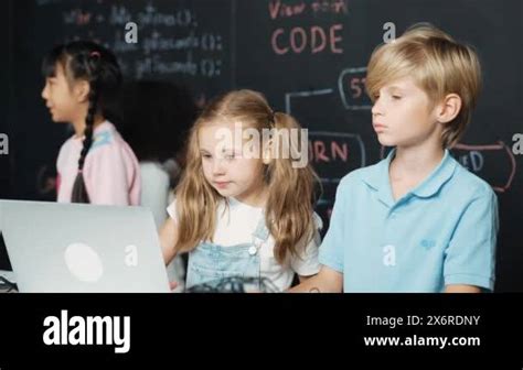 smart girl using laptop programing engineering code with diverse