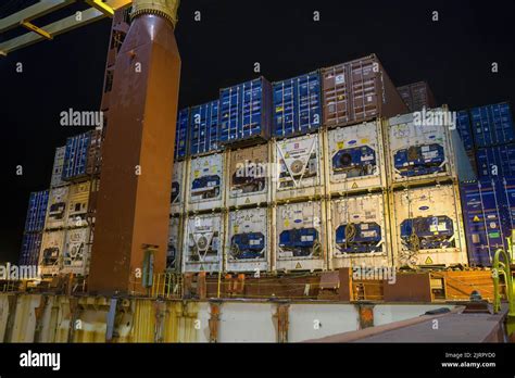 Containers Loading By Crane In The Night Trade Port Container Operation In Port Series Stock