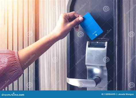 Hand Inserting Key Card To Unlock A Door Security Authentication In The Hotel Or Apartment