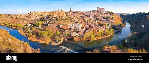 Panoramic View Of The Historic City Of Toledo With River Tajo At Sunset