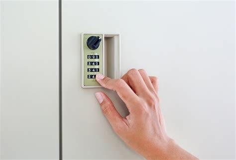Premium Photo Finger At Combination Code Lock On Cabinet Door Of Safe