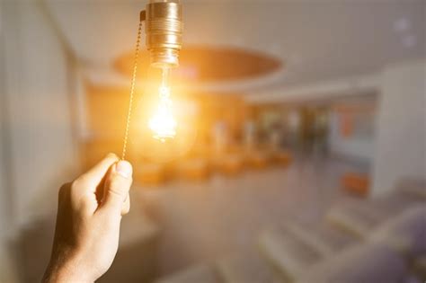Premium Photo Hand Turning Off The Bulb Lampturning Off