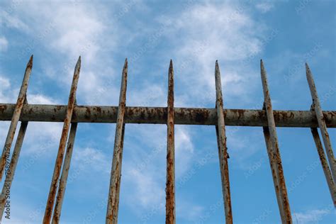Old Rusty Fence With Signs Of Age And Neglect Work To Remove The Rust And Apply Anti Rust And