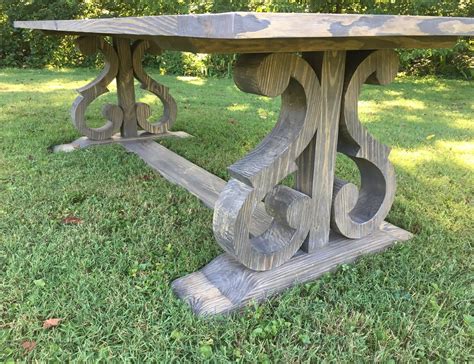 The Scroll Base Trestle Table