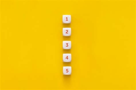 Premium Photo Subes With Numbers On Yellow Background Step By Step