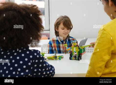 Boy In School Computer Coding Class Building And Learning To Program
