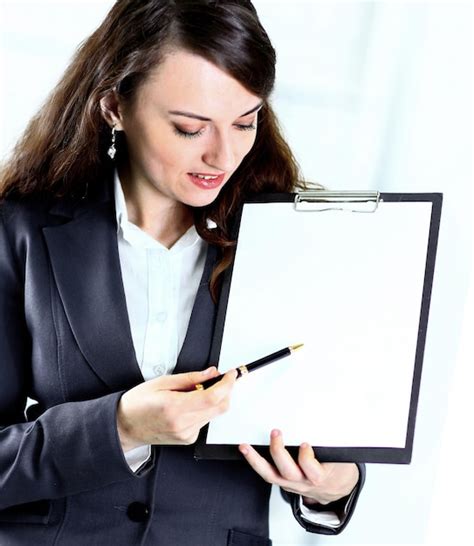 Premium Photo Portrait Of A Cute Young Business Woman With The Work Plan Smiling In Office
