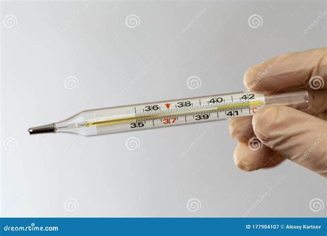 High Body Temperature Mercury Thermometer In The Hands Of A Nurse Body Temperature Measurement