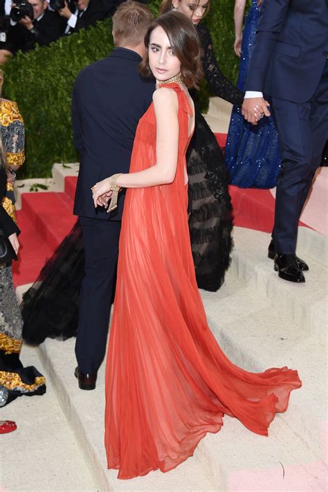 Lily Collins In A Copper Orange Chiffon Plissé Gown From Haute Couture