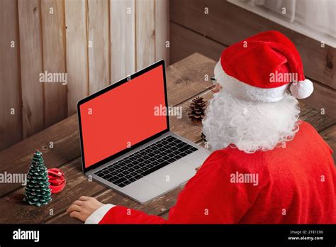 Santa Claus Typing On Laptop At Home Isolated Screen For Mockup Copy Web Page Or App