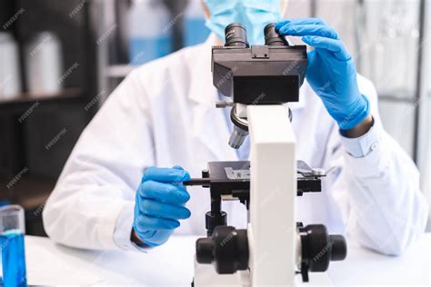 Premium Photo Professional Research Scientist Using Microscope In