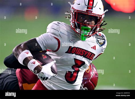 Louisville Wide Receiver Kevin Coleman 3 Is Tackled By Southern California Safety Jaylin Smith