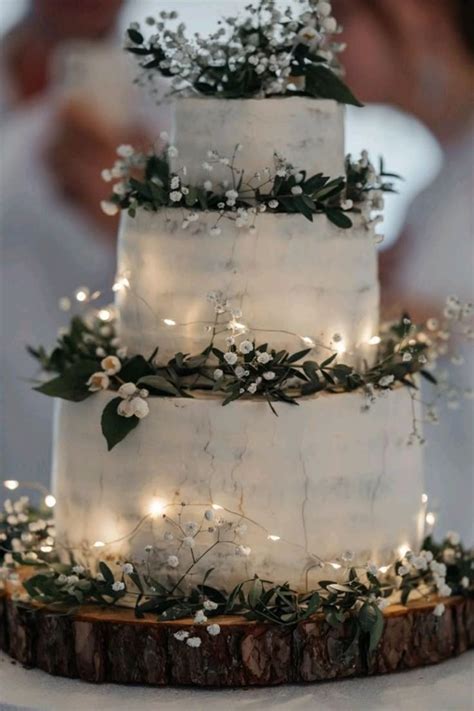 Rustic Wedding Cake With Greenery And Lights