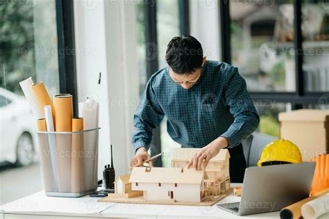 male architect hands making model house man architect working in the