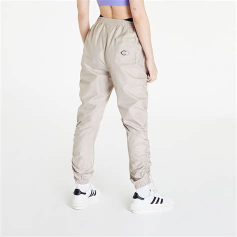 Kalhoty Reebok X Cardi B Woven Pants Moderate Beige Footshop