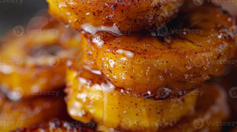 A Stack Of Crispy Fried Plantains Drizzled With A Sweet Coconut Glaze