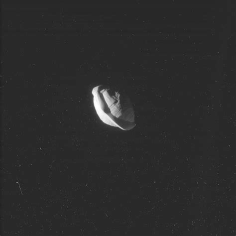 Pan Saturns Flying Saucer Shaped Moon Up Close Space Exploration