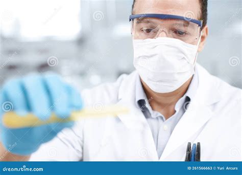 Safety First Closeup Of A Chemist In The Process Of Mixing Chemicals Stock Image Image Of