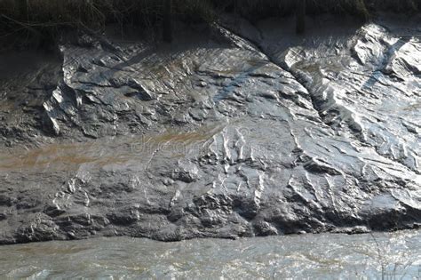 Full Frame Image Of Mud Flat With Small River In Foreground Stock Image Image Of Shore