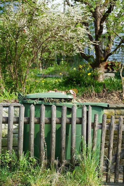 Two Plastic Containers For Organic Waste In A Garden Slightly Open