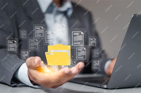 Premium Photo Businessman Using Laptop With Database On Computer To Store Files Document Data